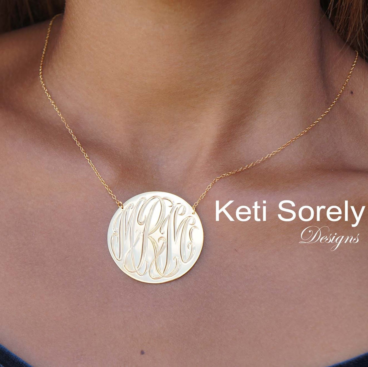 Hand engraved monogrammed initials disc in sterling silver or solid gold.
